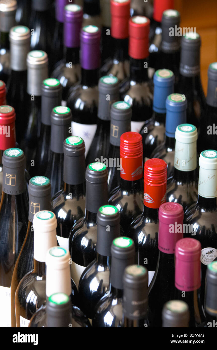 Many bottles and bottle necks in preparation for a large winetasting ...