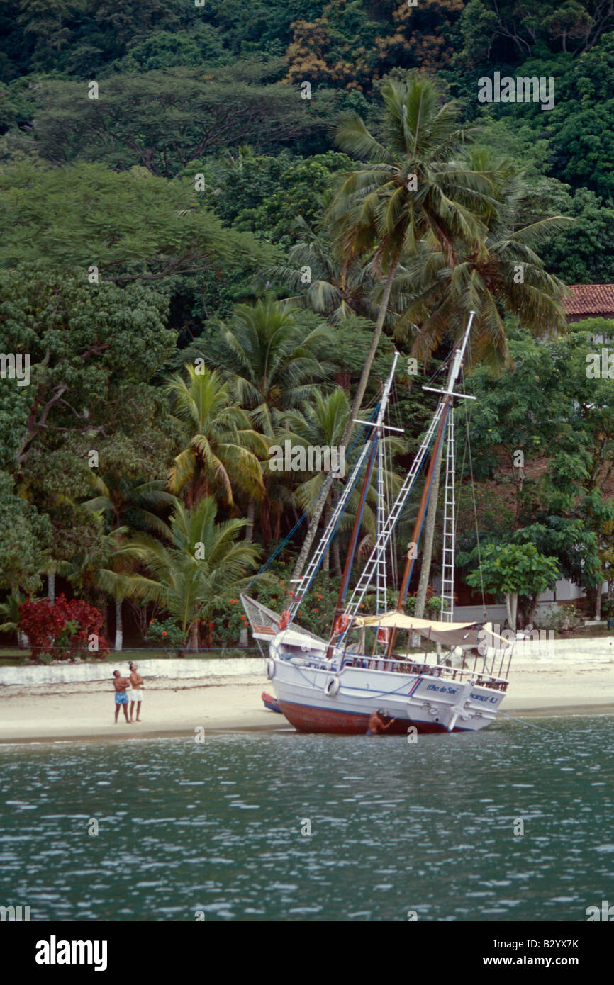 Boat on a beach in Brazil Stock Photo - Alamy