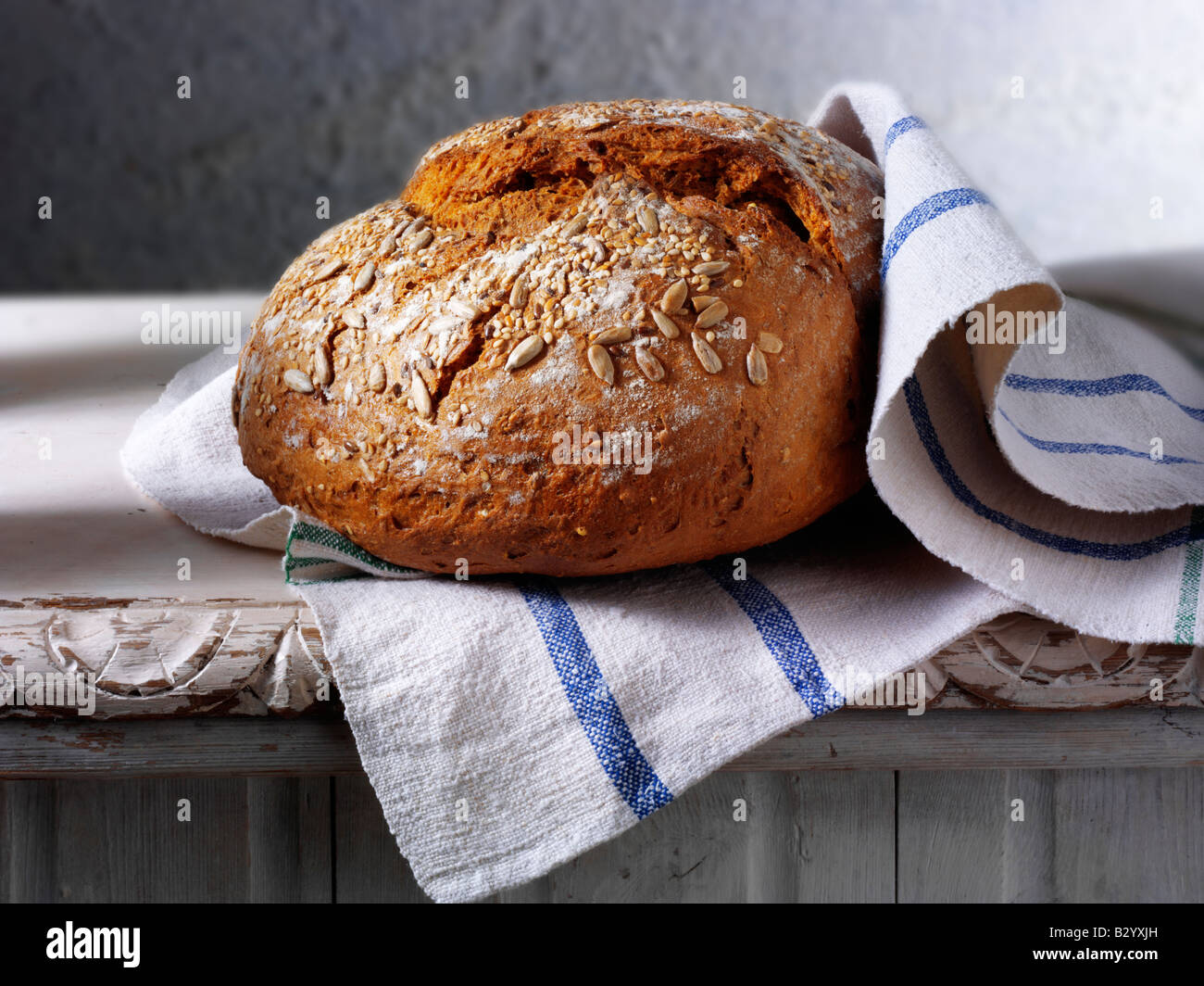 loaf of artedab sour dough wholemeal bread in a rustic setting on a ...