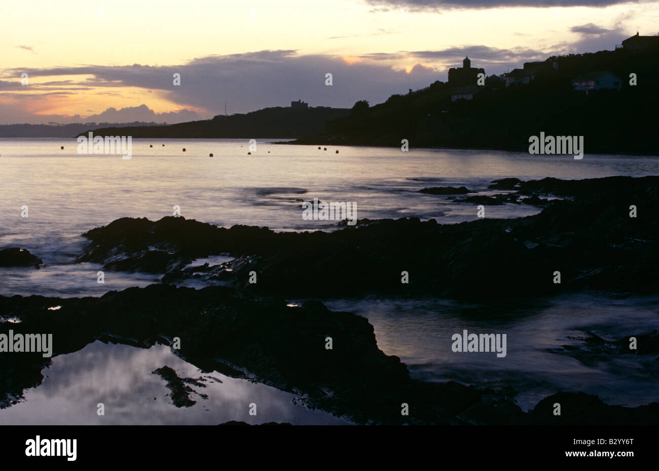 River Fal estuary with the silhouette of St Mawes Castle visible on the ...