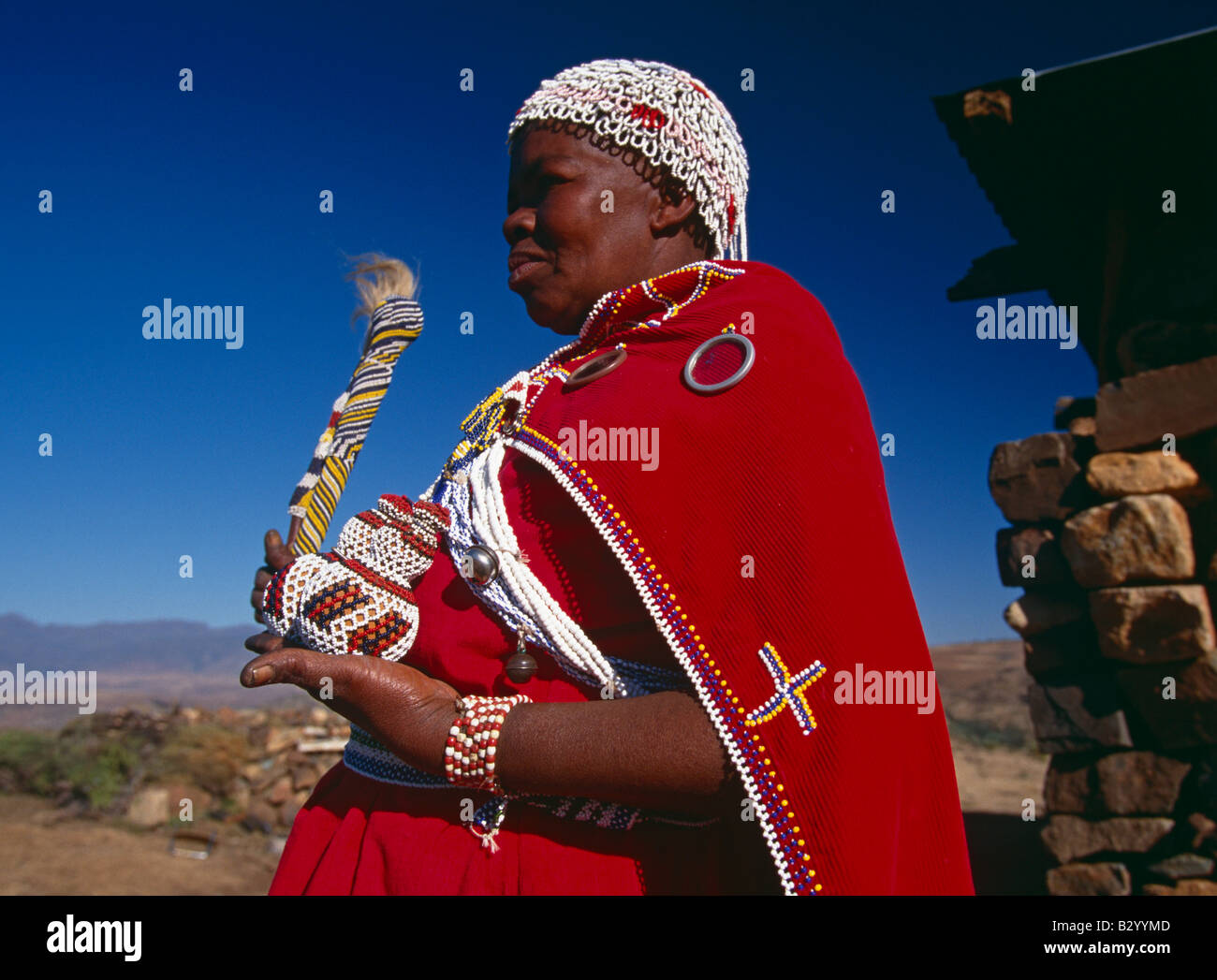 Woman wearing traditional costume with beaded decoration and headdress ...