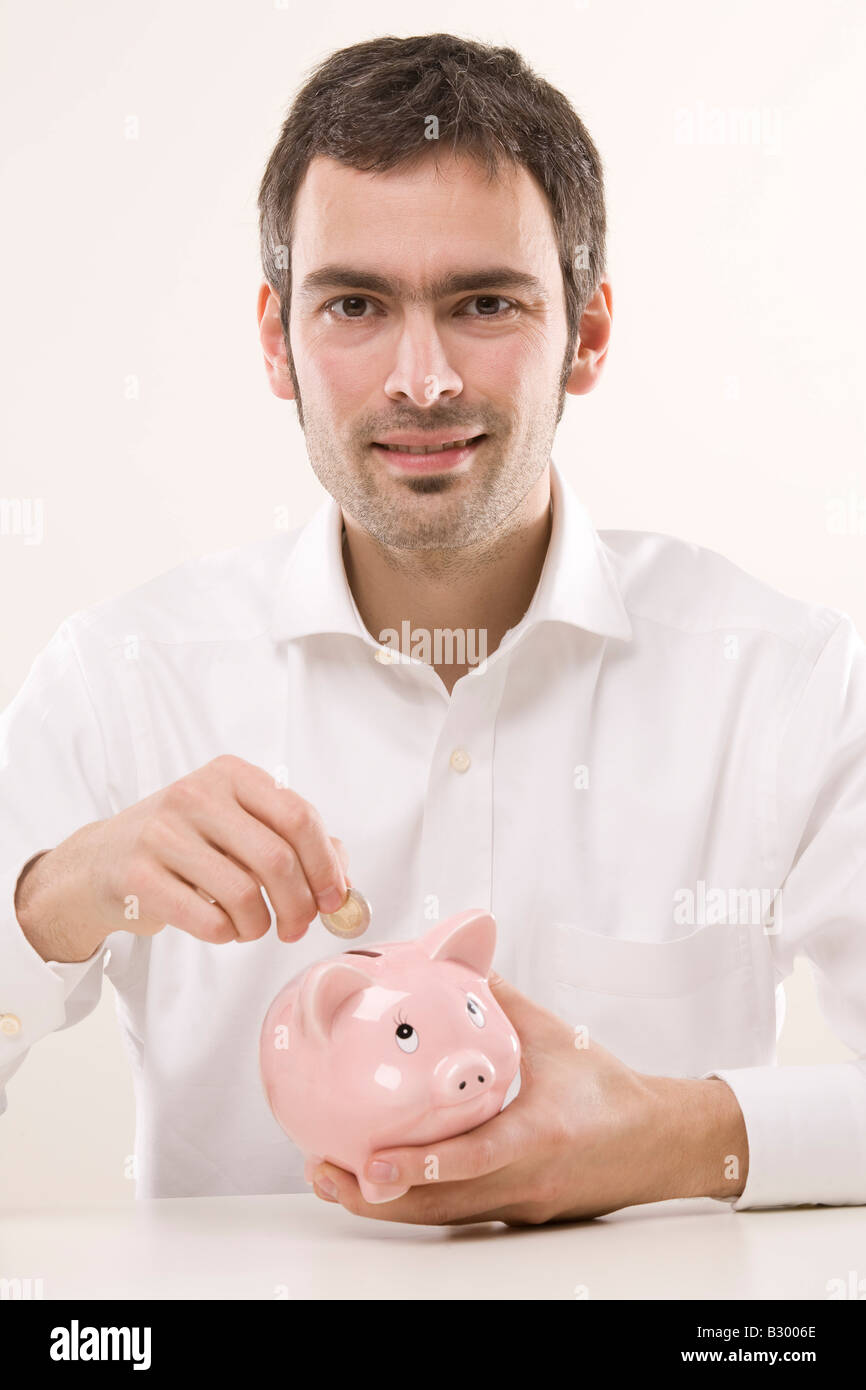 Man with Piggy Bank Stock Photo - Alamy