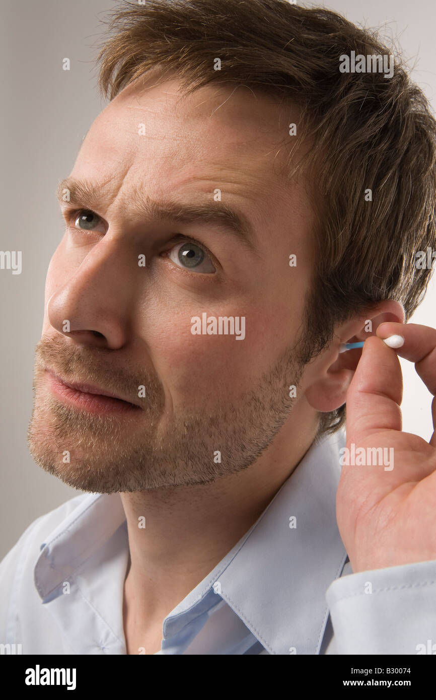 Man Cleaning Ears Stock Photo - Alamy