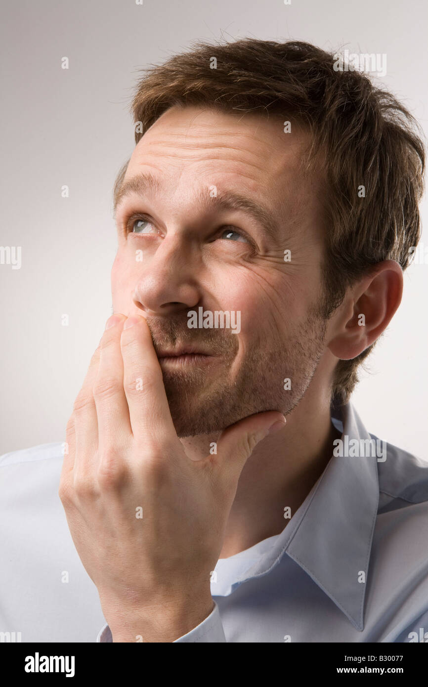 Portrait of Man Thinking Stock Photo - Alamy