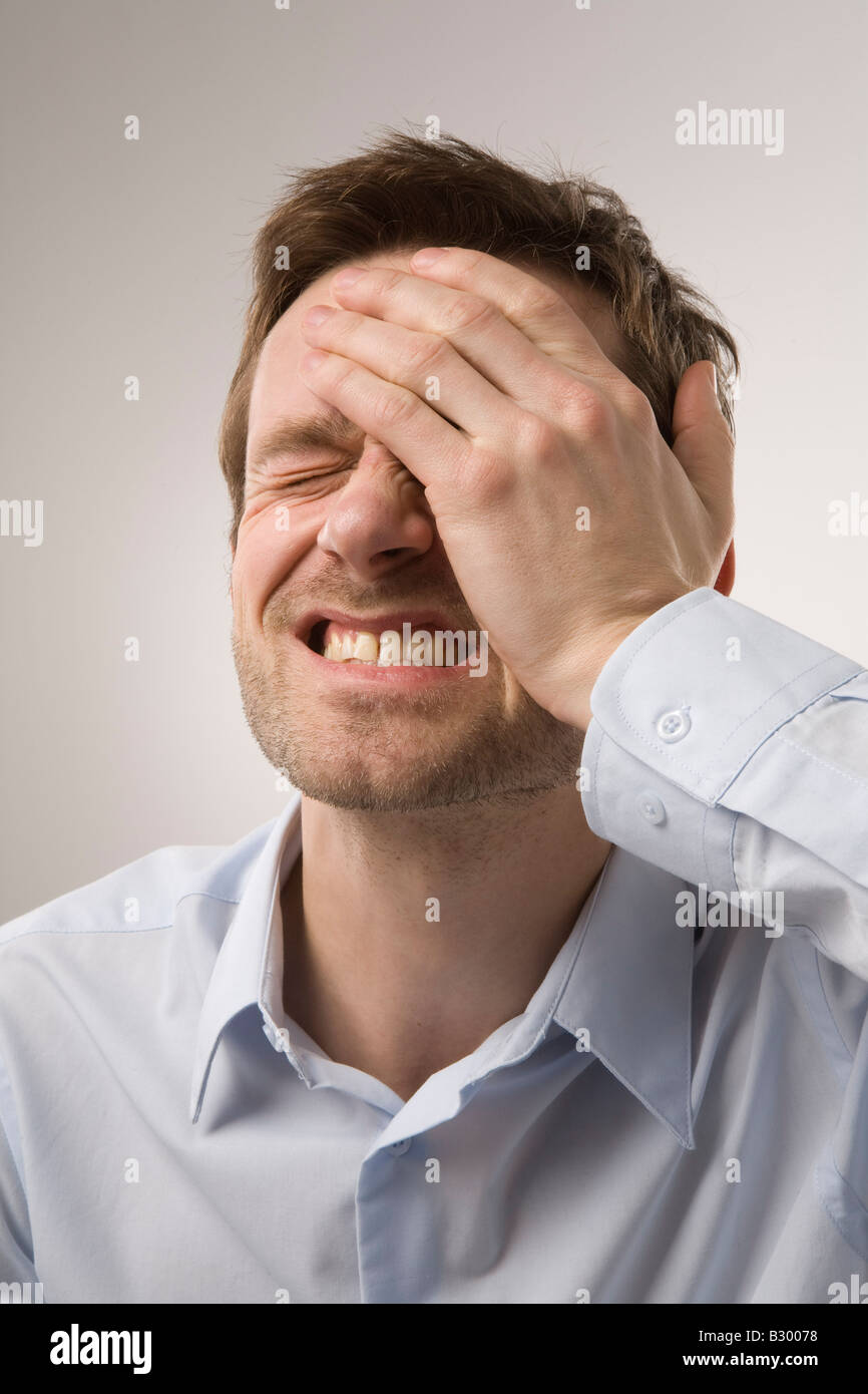 Portrait of Man With Headache Stock Photo - Alamy