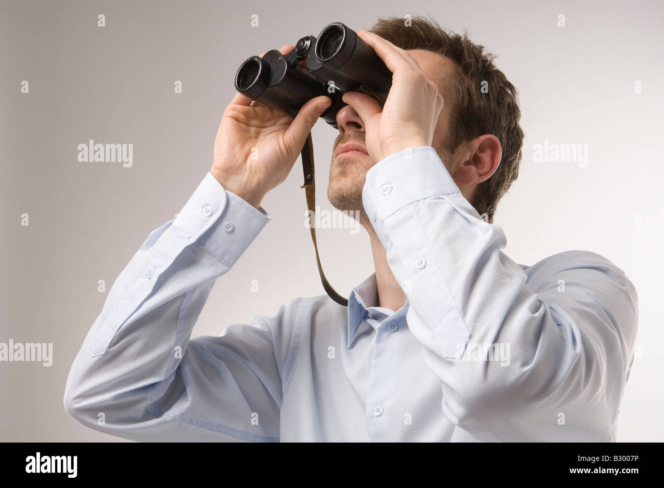 Man Using Binoculars Stock Photo - Alamy
