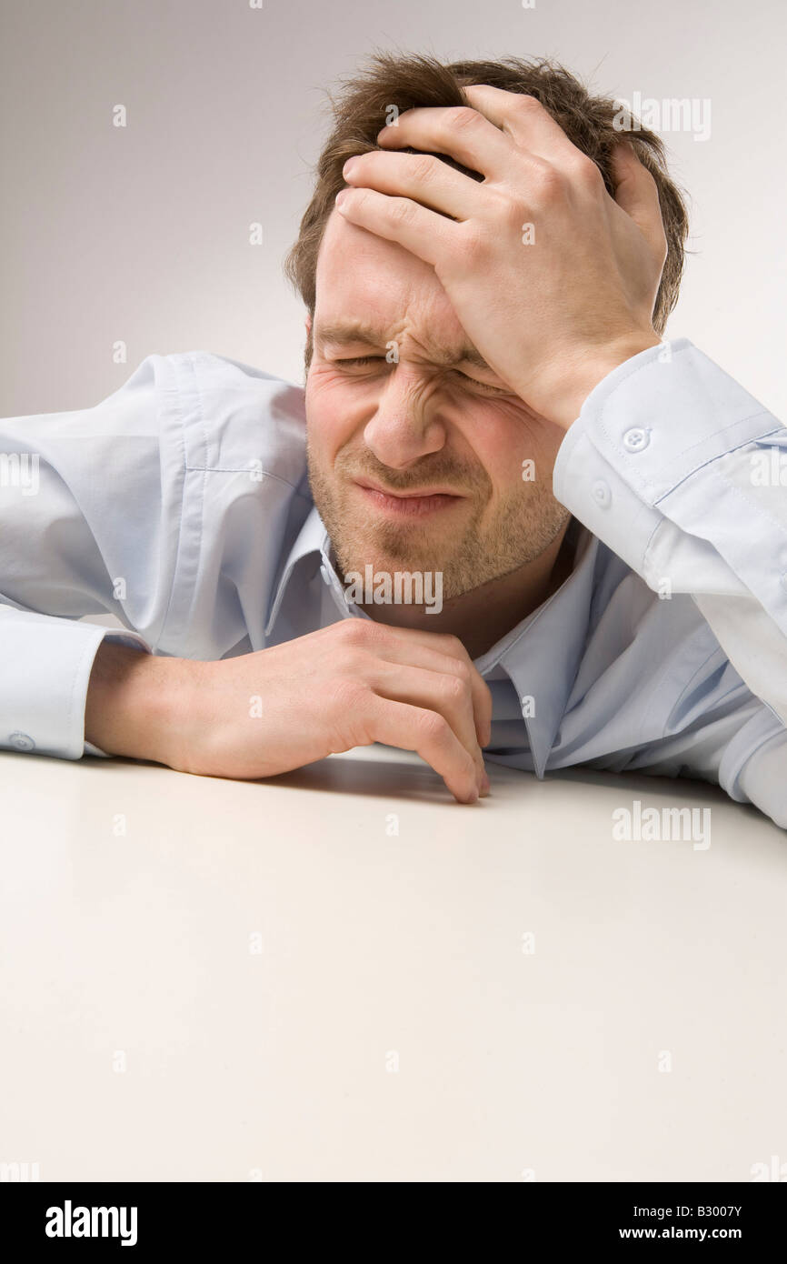 Portrait of Man With Headache Stock Photo - Alamy