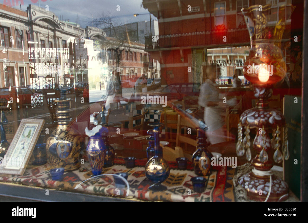 Shop window with reflections of the street in London Stock Photo - Alamy
