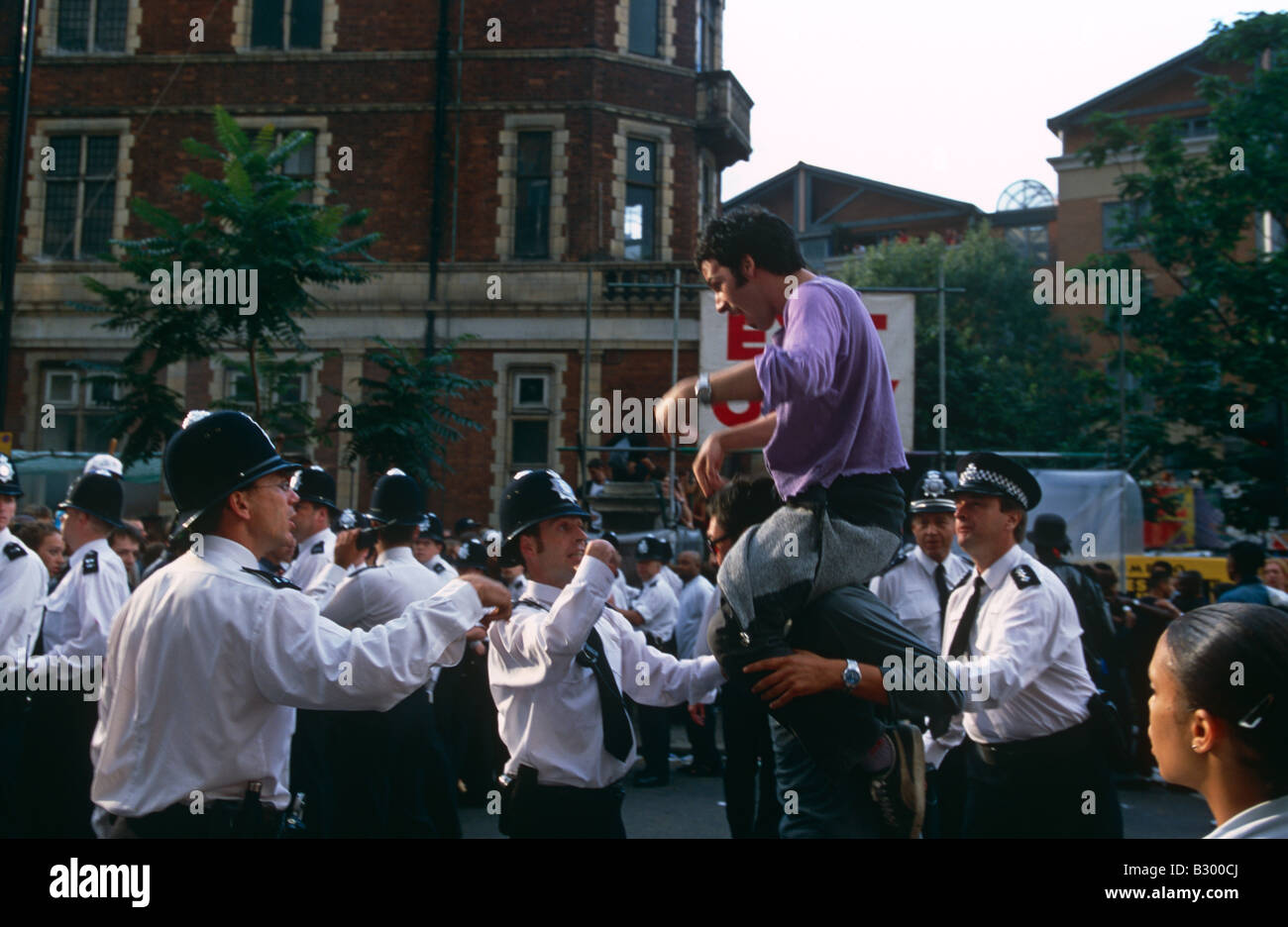 Police controlling the crowd at a carnival in London Stock Photo - Alamy