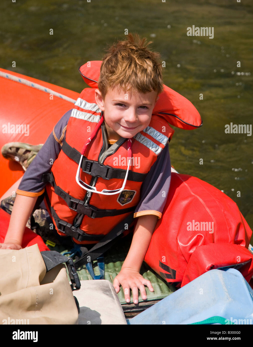 Idaho, Rafting on the Middle Fork of the Salmon River. A young boy ...
