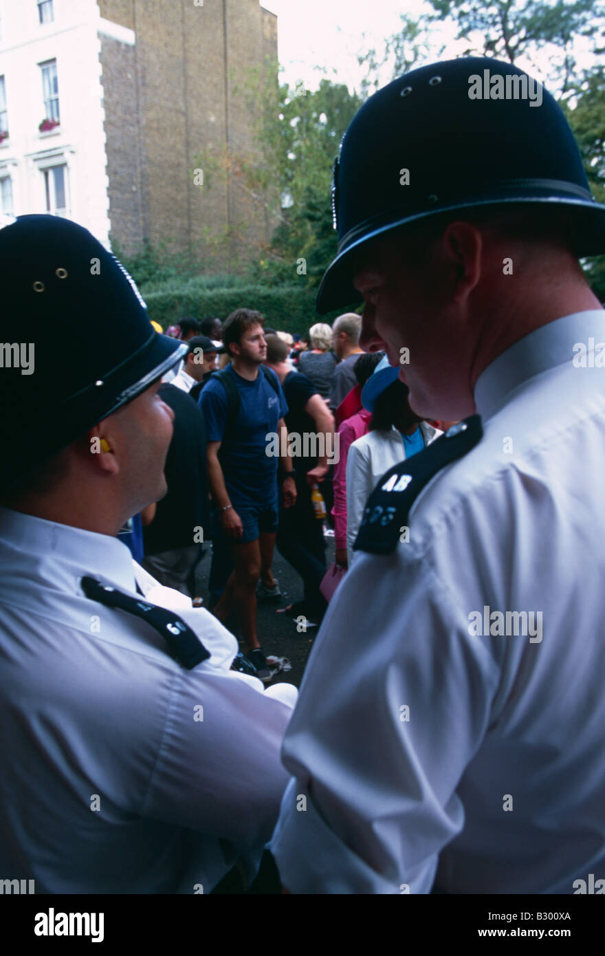 Police controlling the crowd at a carnival in London Stock Photo - Alamy