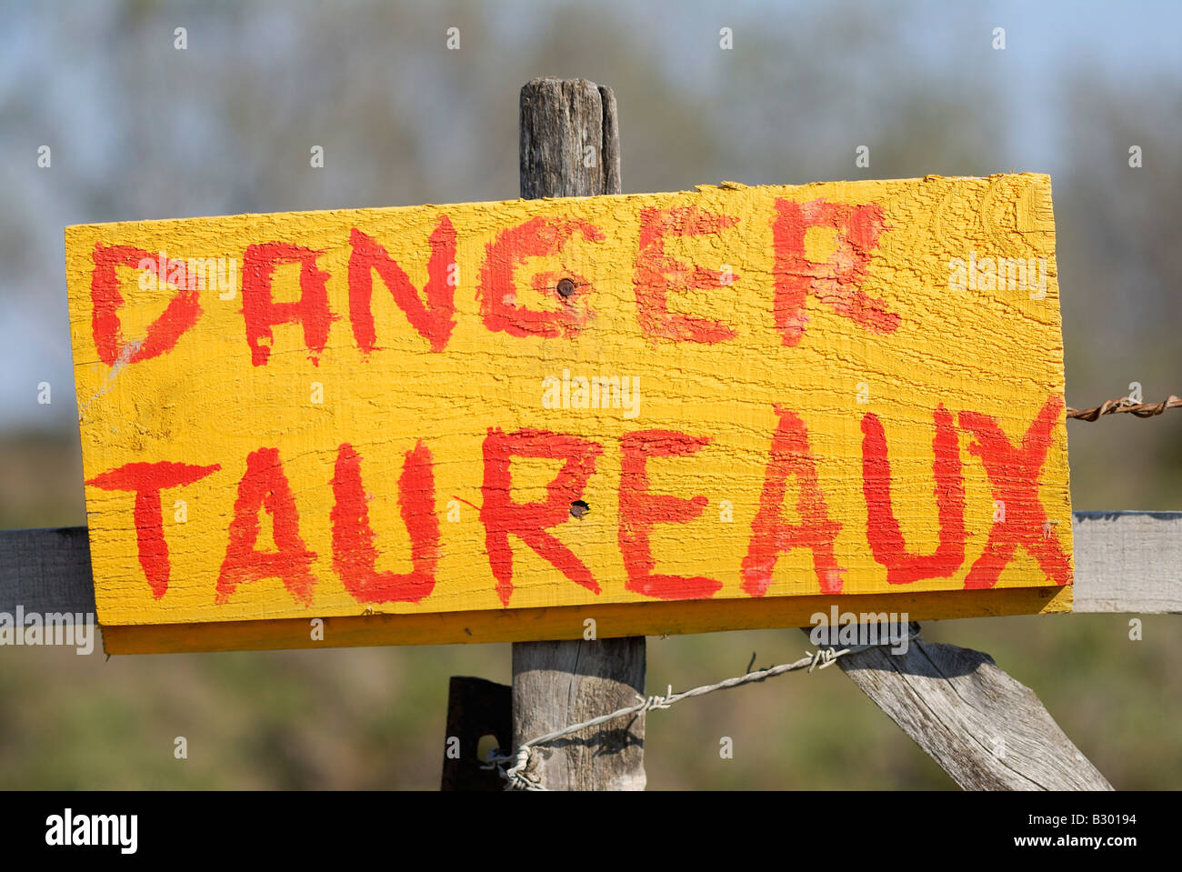 Danger Sign on Wooden Fence Stock Photo - Alamy