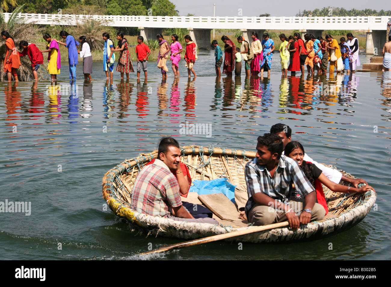 A group enjoys a coracle ride at Balmuri Waterfalls, near Mysore ...