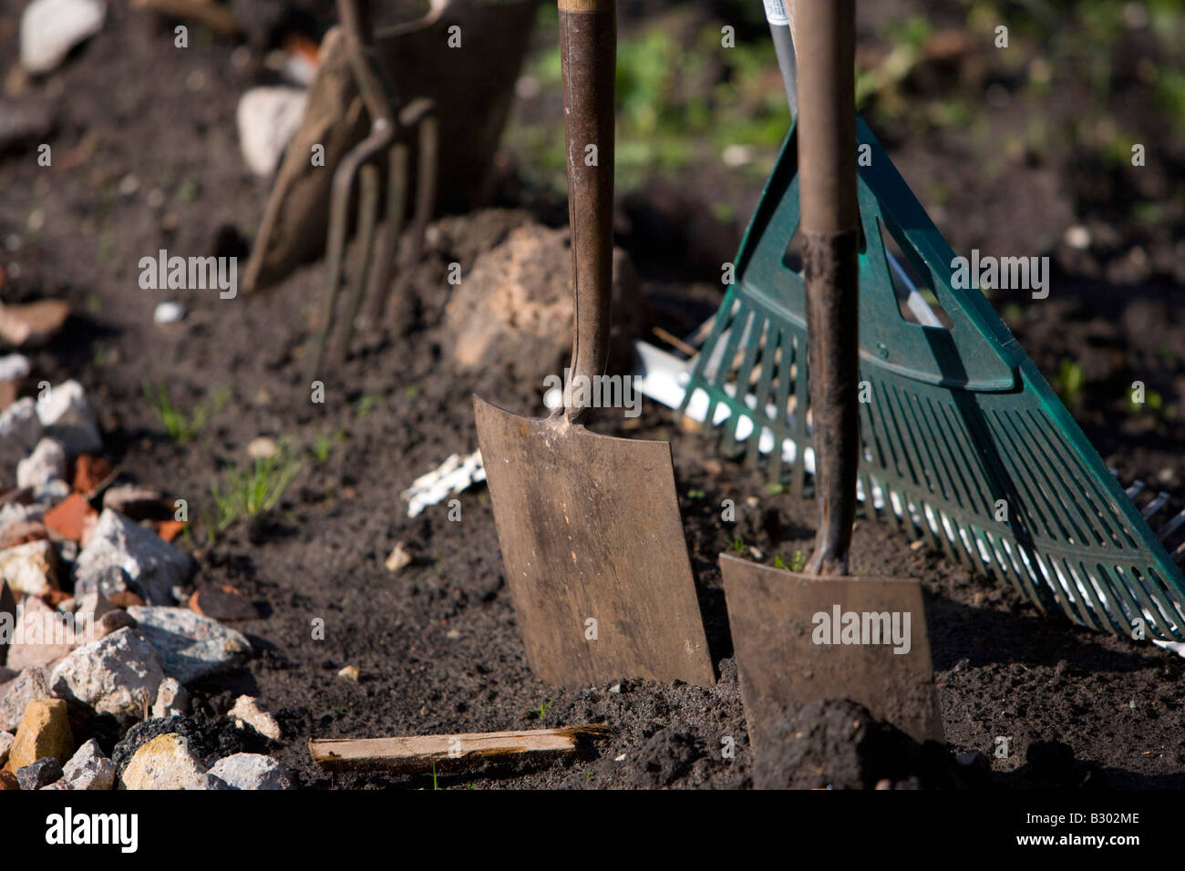 tools used in the garden. spade, fork and rakes Stock Photo - Alamy