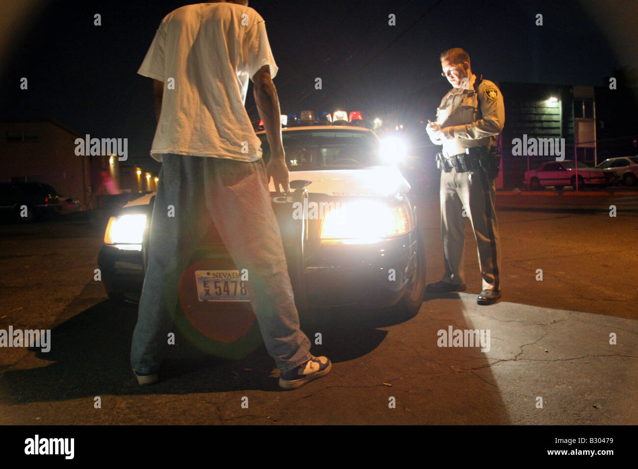 Suspect being stopped and questioned by police in a back alley in Las ...