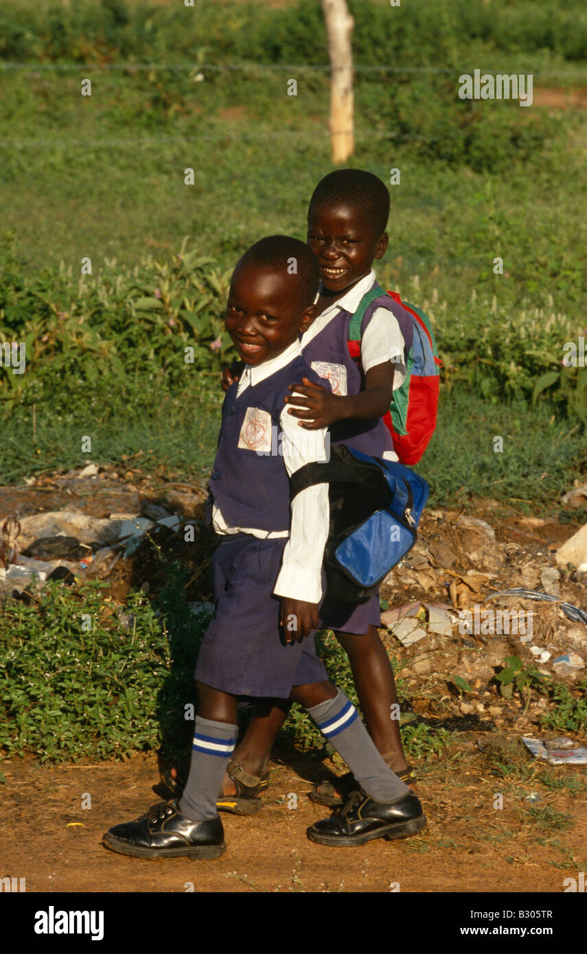 Children in uniform with bags hi-res stock photography and images - Alamy