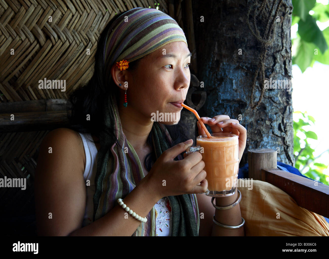 a young Chinese women is enjoying a fruit shake Stock Photo - Alamy