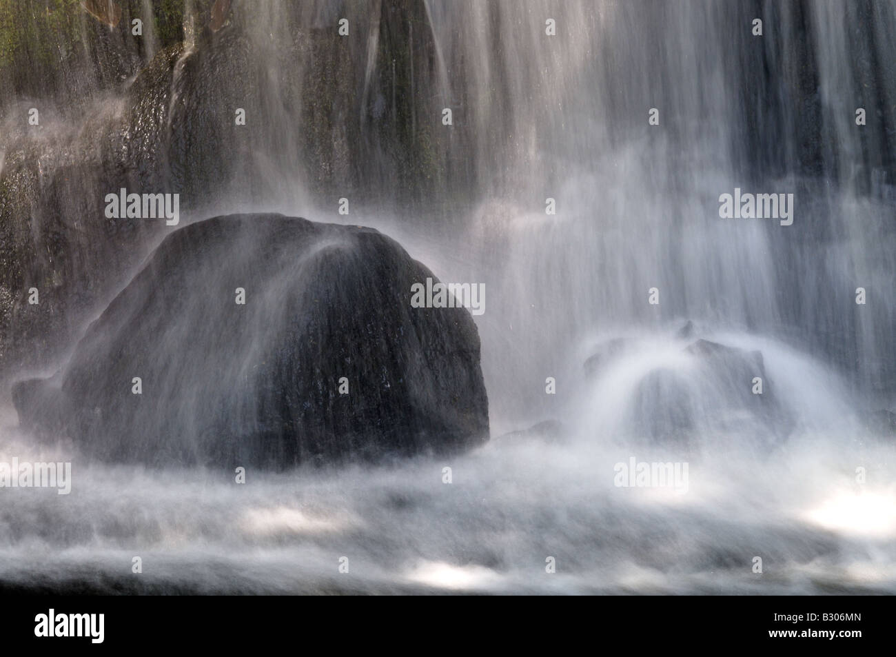 The contrast between a hard rock and a flowing stream captured in this ...