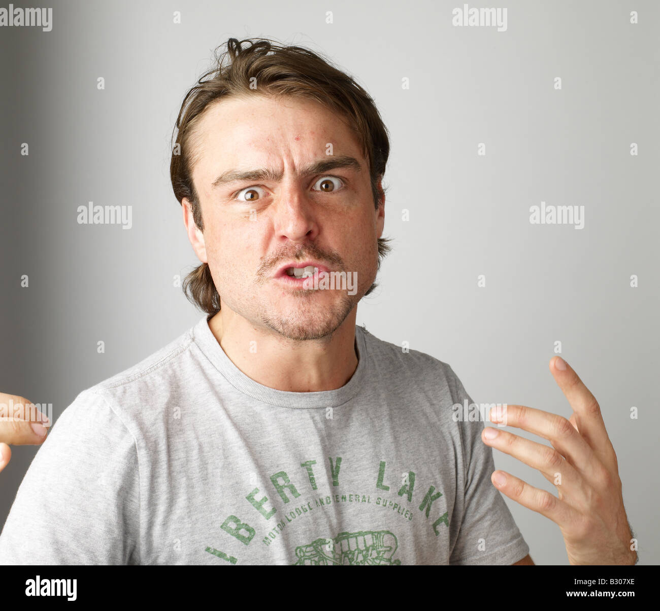 Angry and mean looking man Stock Photo - Alamy