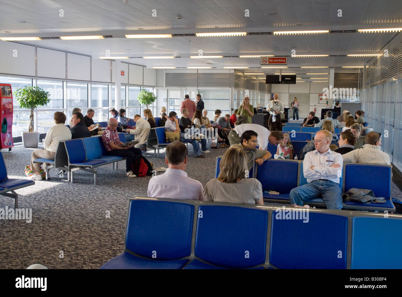 Waiting to board at Gatwick Airport north terminal gate 63 Stock Photo ...