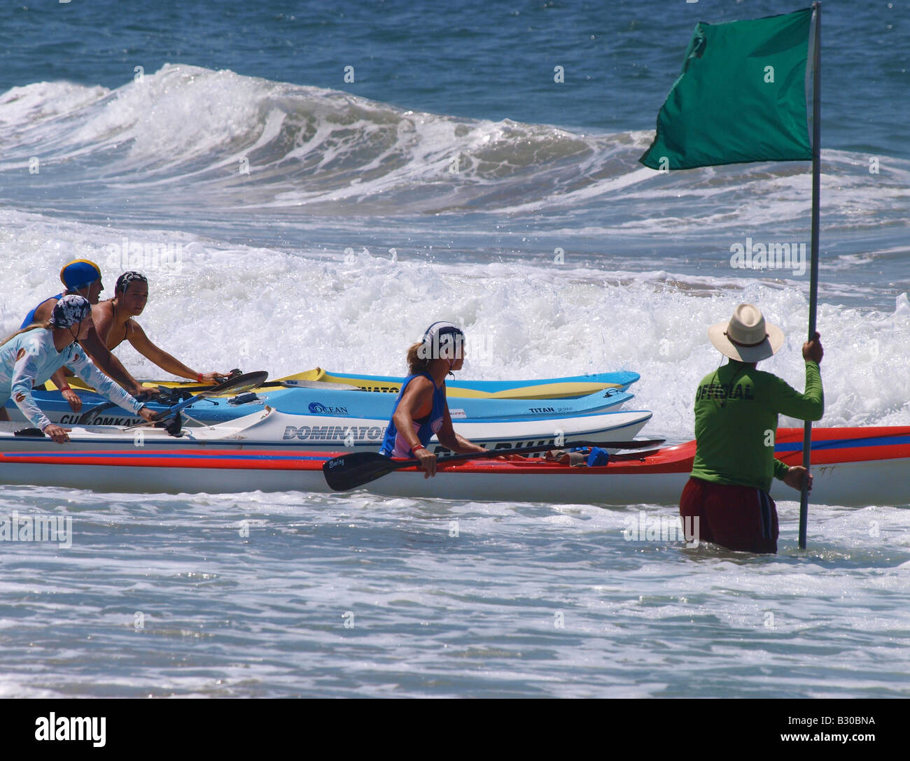Lifeguard surf ski contestants pass course marker Stock Photo - Alamy