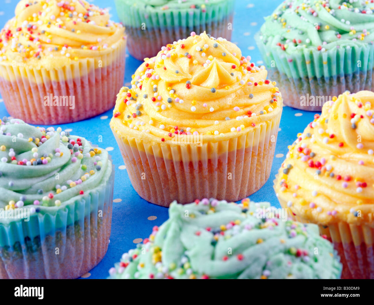 BLUE AND YELLOW CUPCAKES Stock Photo - Alamy