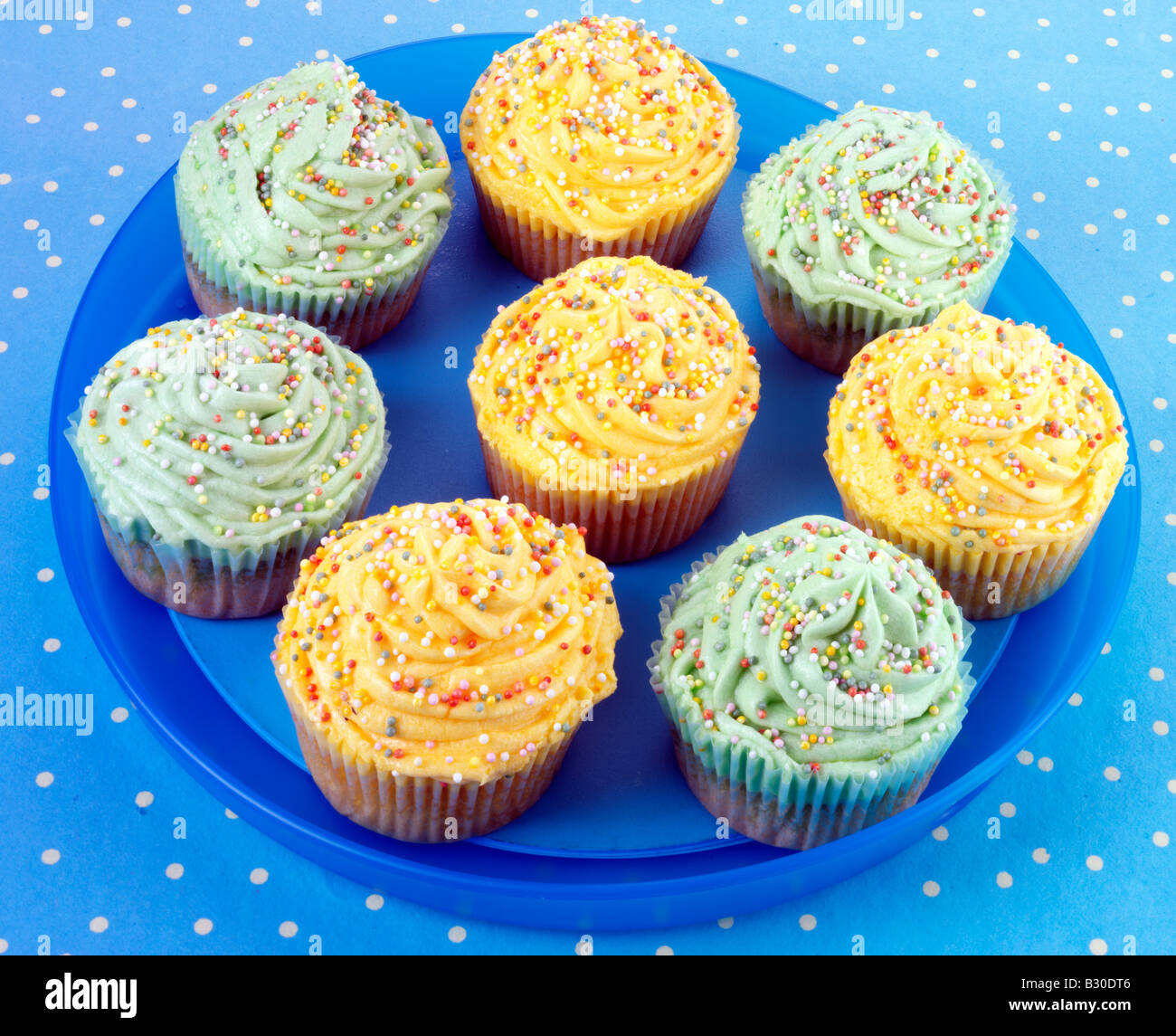 YELLOW AND BLUE CUPCAKES Stock Photo - Alamy