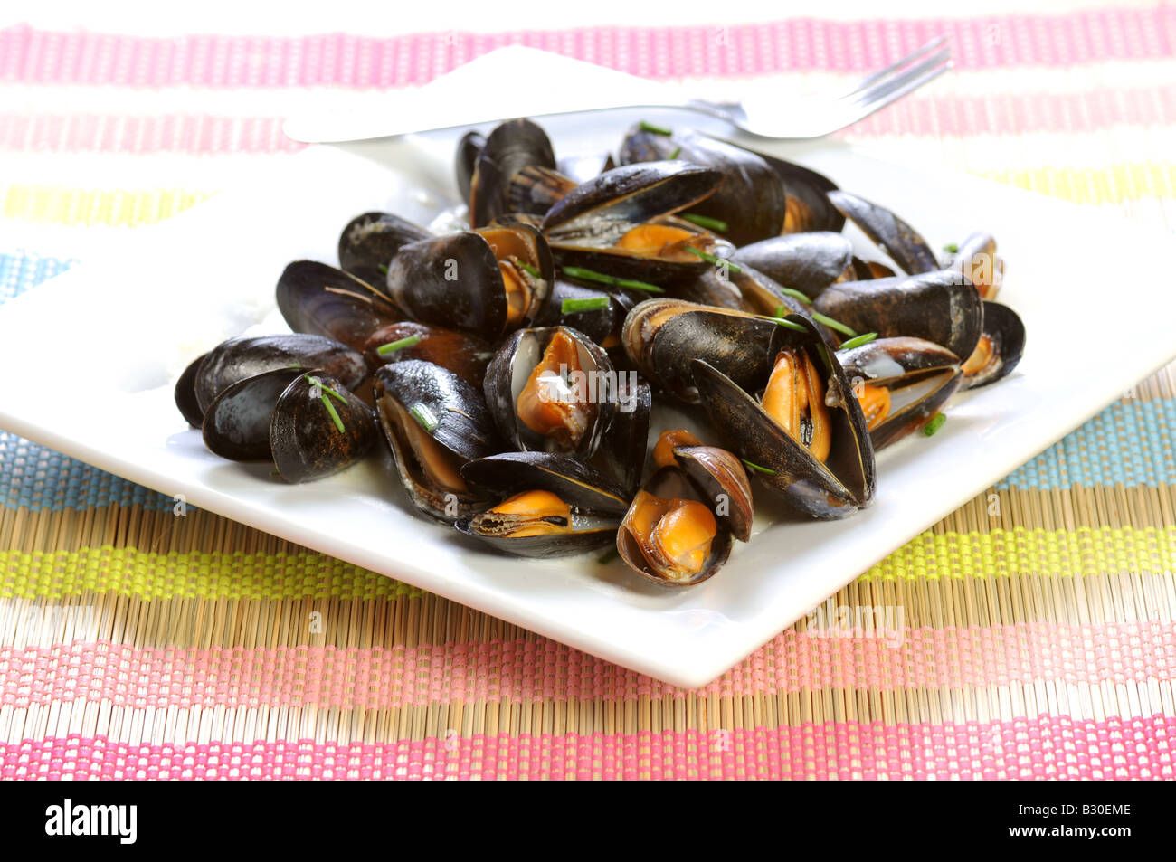 a plate of mussels seafood with a garlic sauce Stock Photo - Alamy