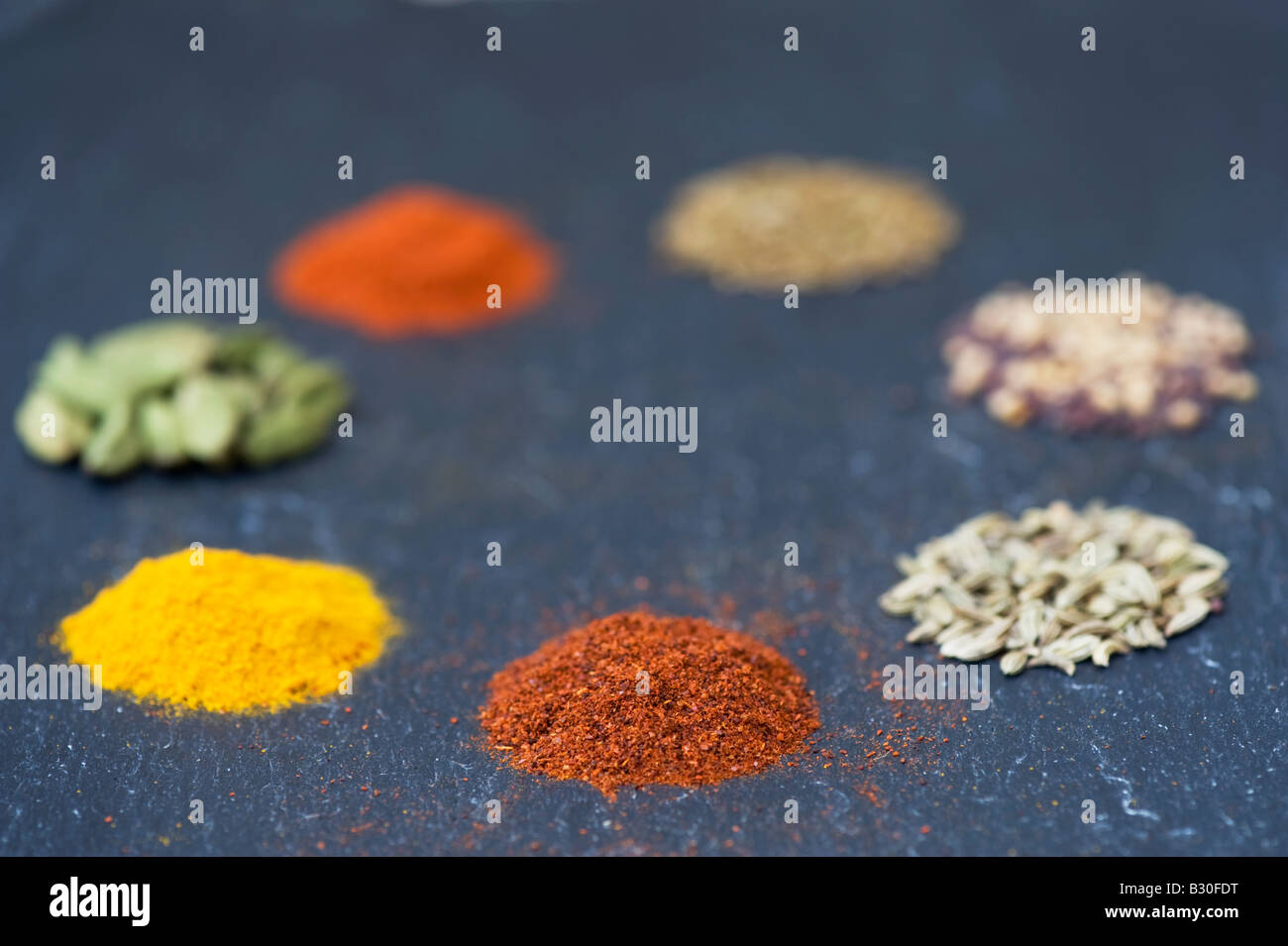 Indian cooking spices on slate Stock Photo - Alamy
