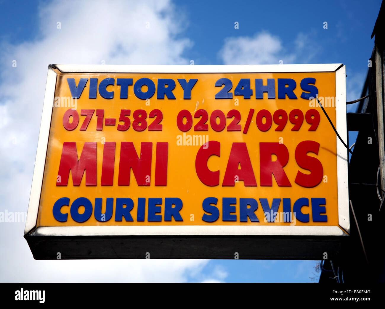 Mini cab sign above office hi-res stock photography and images - Alamy