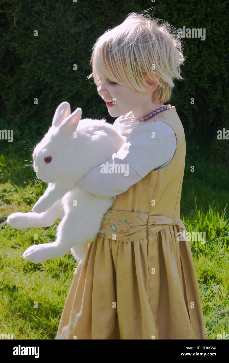 Child white rabbit hi-res stock photography and images - Alamy