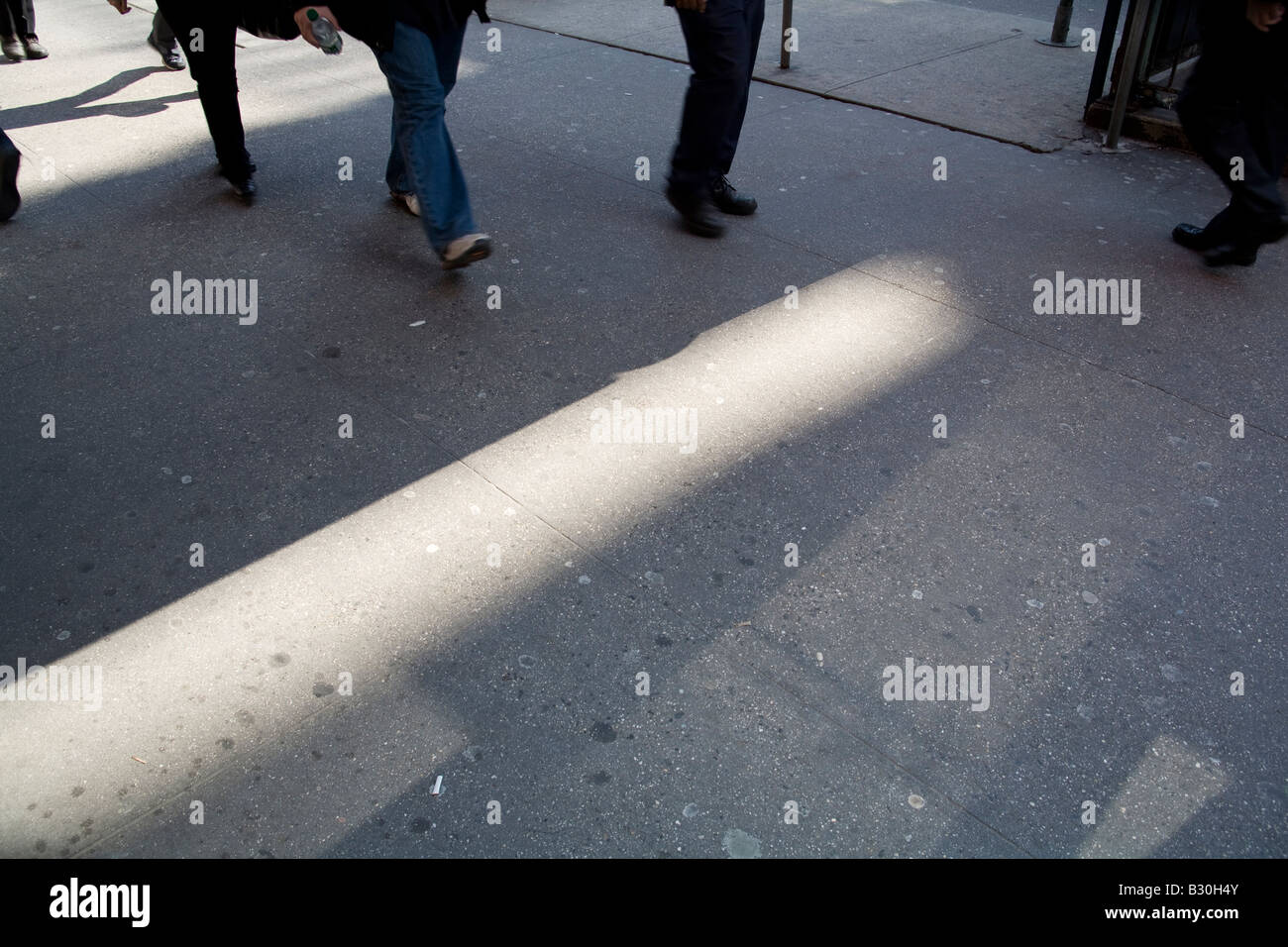 abstract view of people walking along sidewalk in Manhattan Stock Photo ...