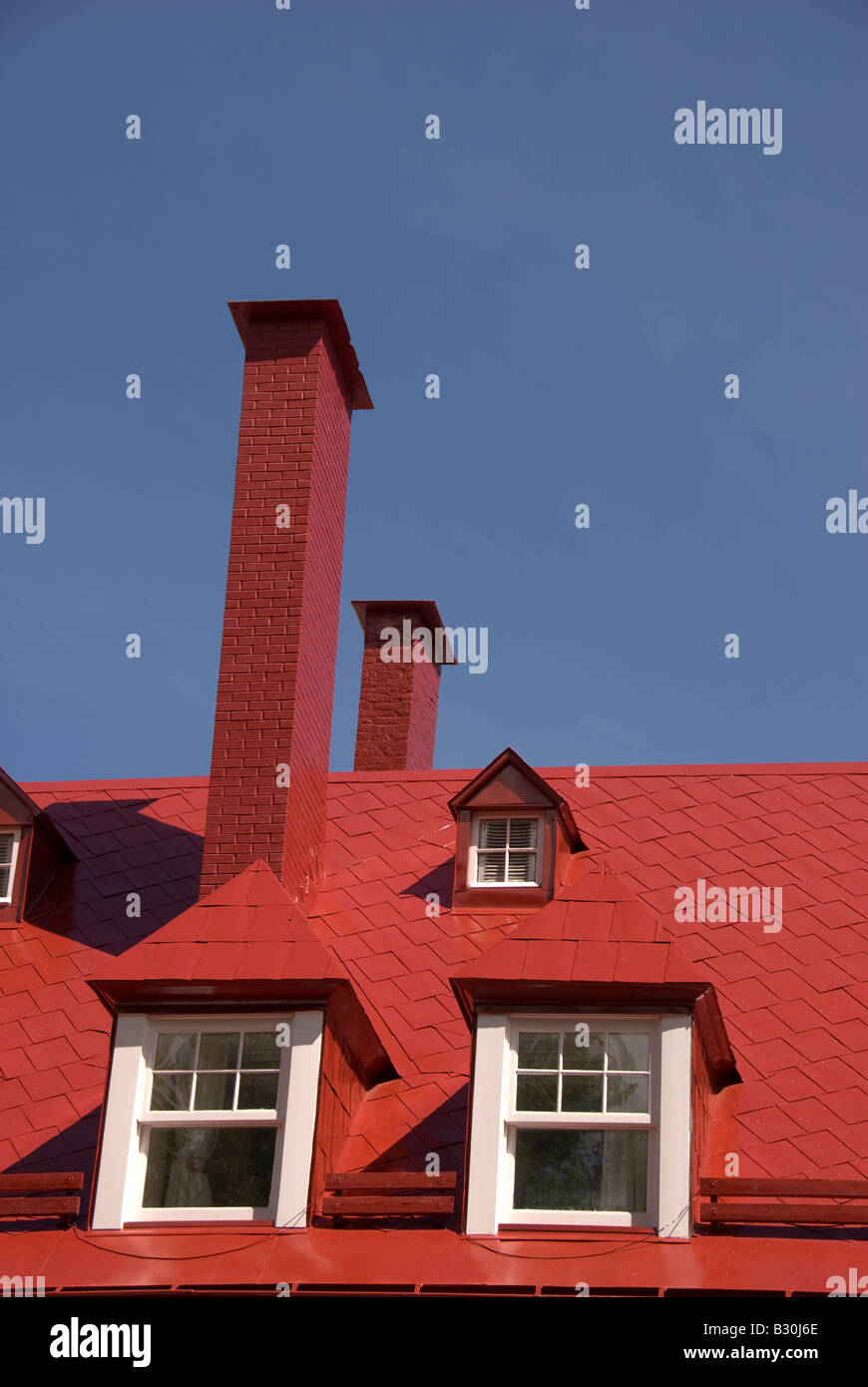 red roof and chimneys traditional French architecture in Quebec City ...