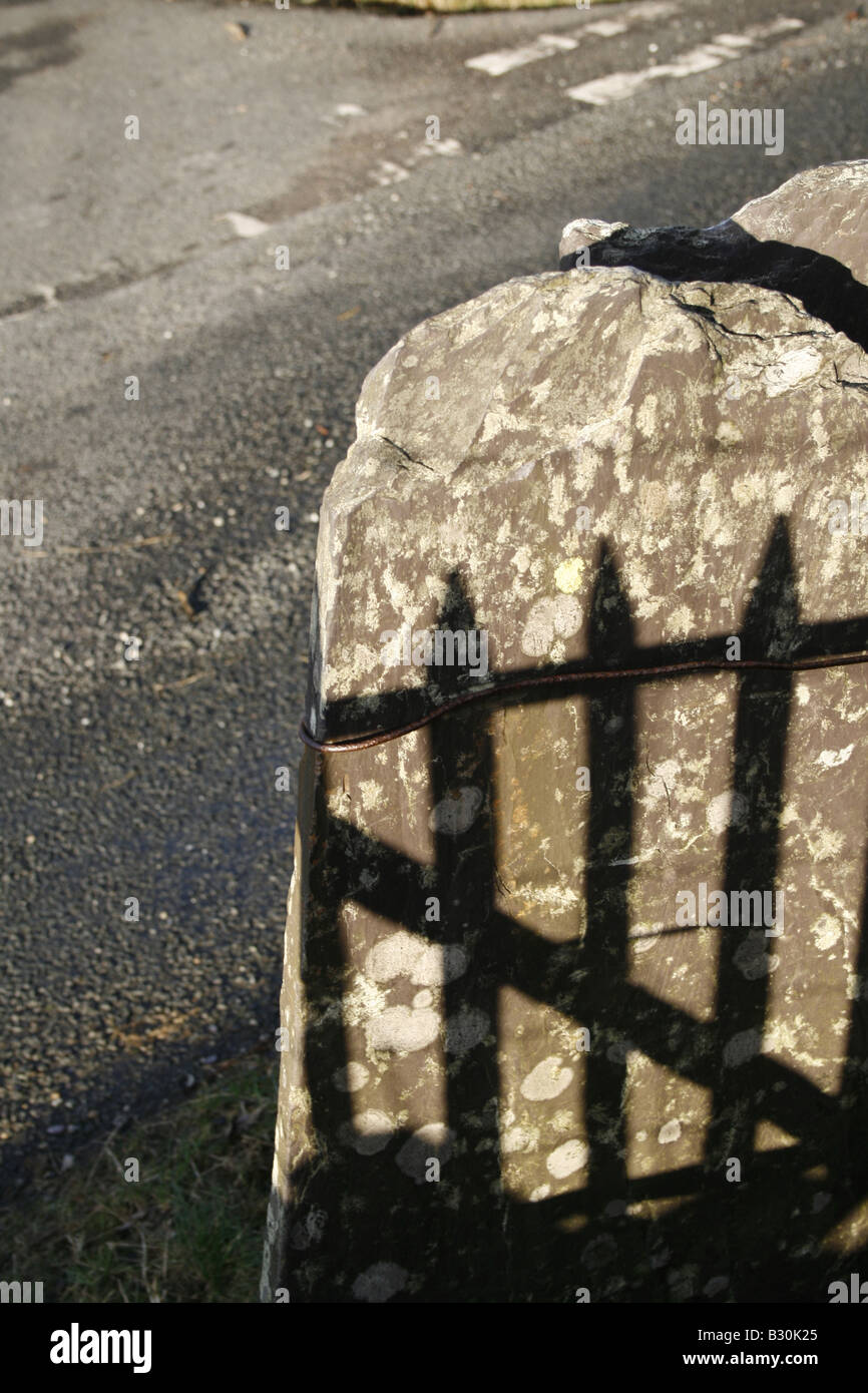 public footpath gate shadow on slate in wales Stock Photo - Alamy