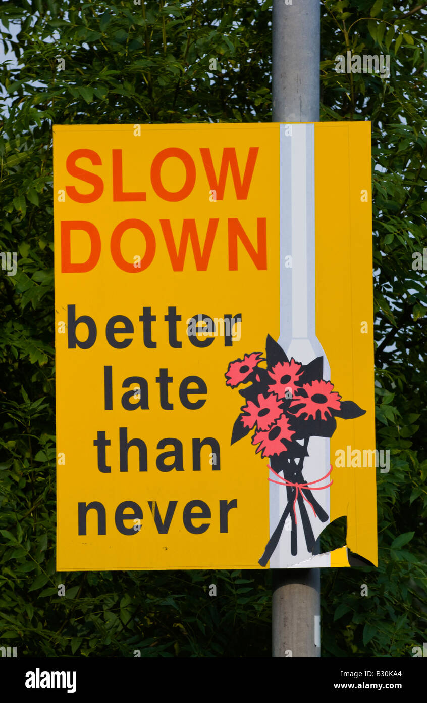 SLOW DOWN BETTER LATE THAN NEVER road safety sign near village of ...