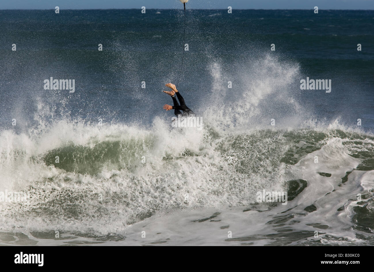 A surfer's feet showing from behind a wave after falling off Stock ...