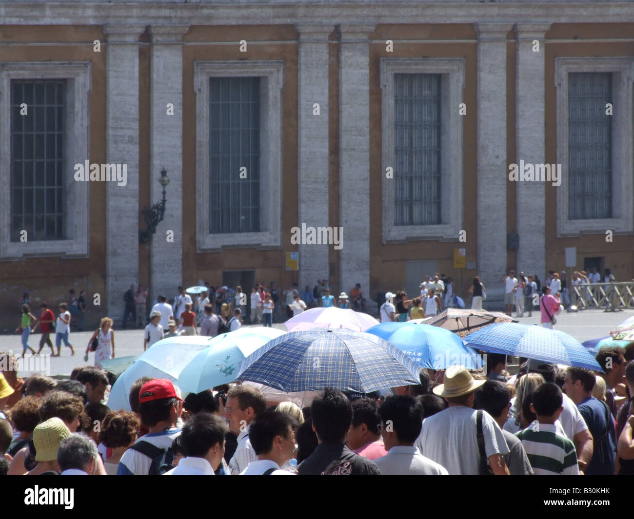 group of tourists with umbrellas in hot sun in rome italy Stock Photo ...