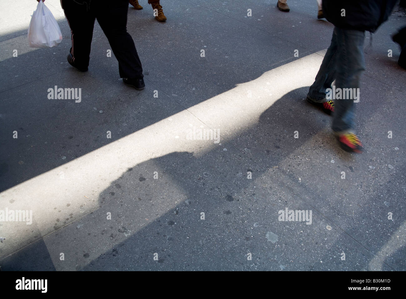 abstract view of people walking along sidewalk in Manhattan Stock Photo ...
