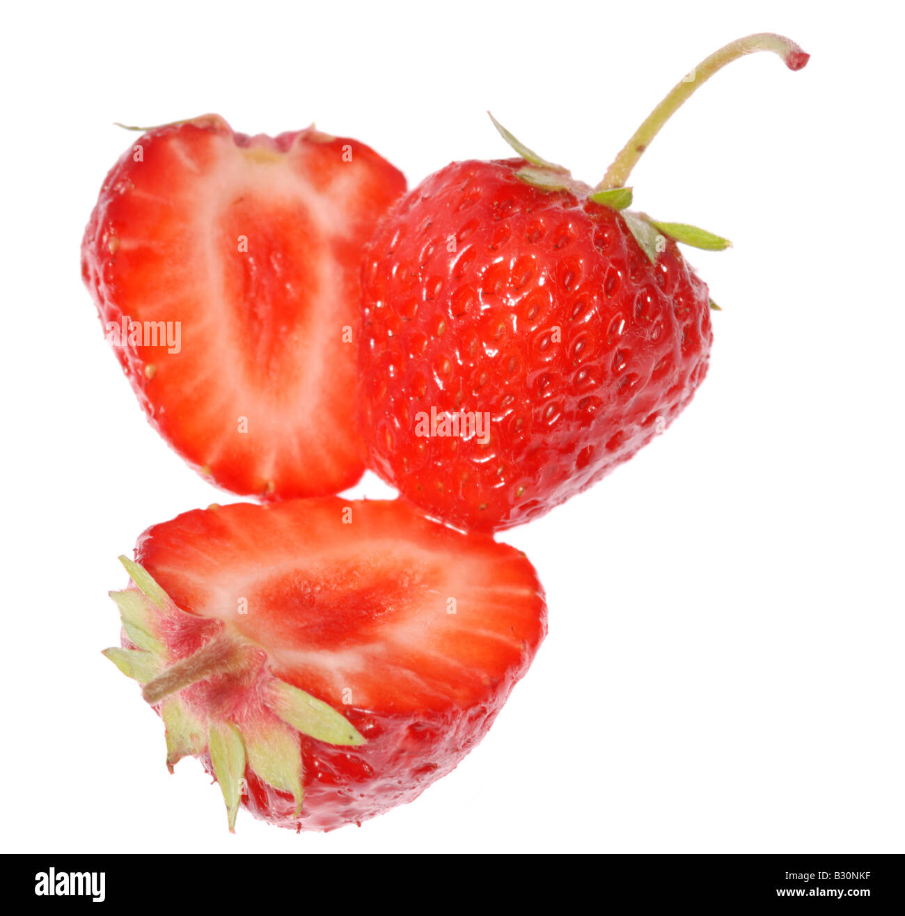 Strawberry cut A berry isolated on a white background Stock Photo - Alamy