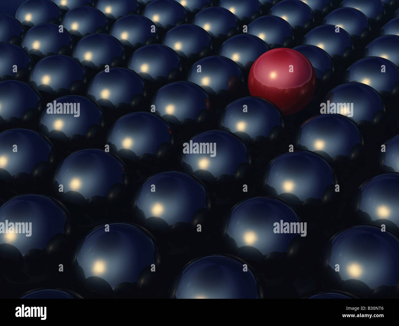 Red metal a unique sphere in set black spheres Stock Photo - Alamy