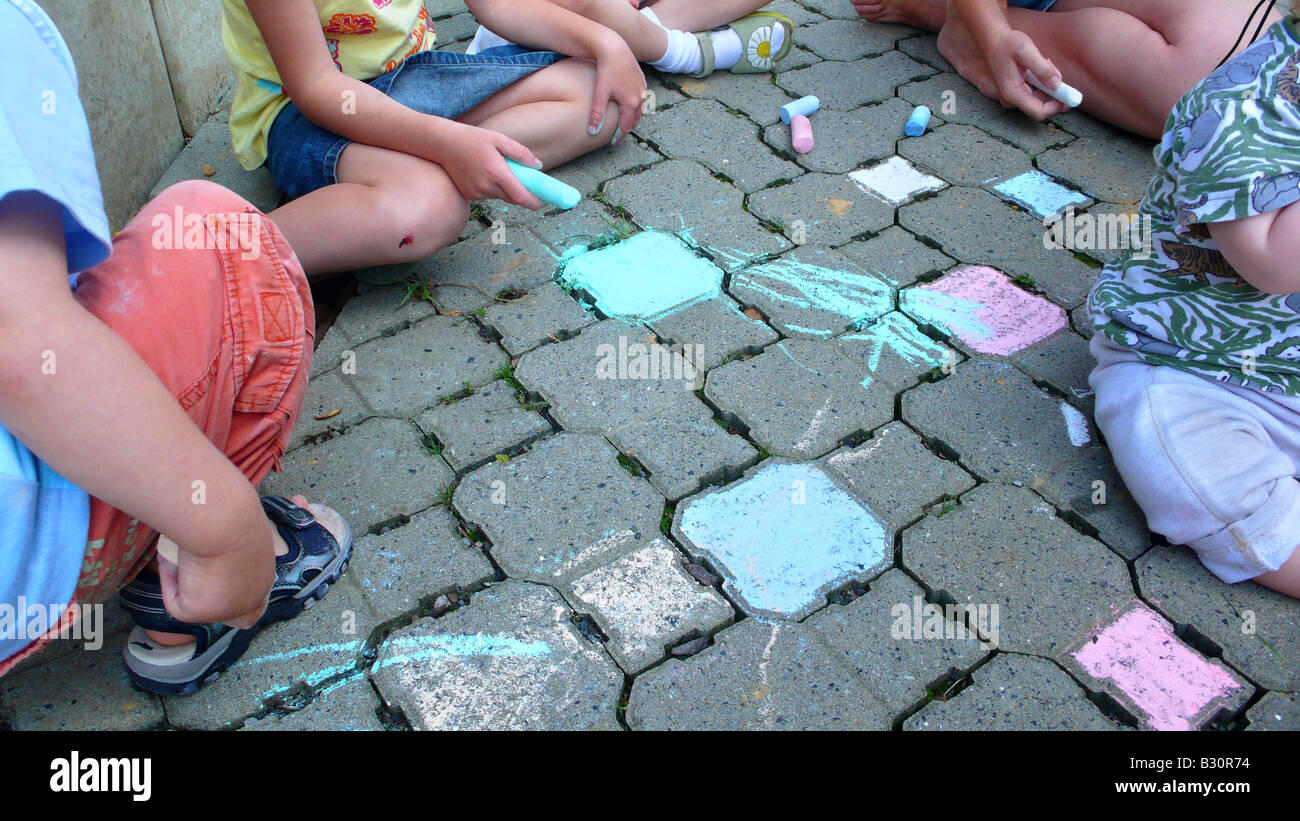 children playing with crayon Stock Photo - Alamy
