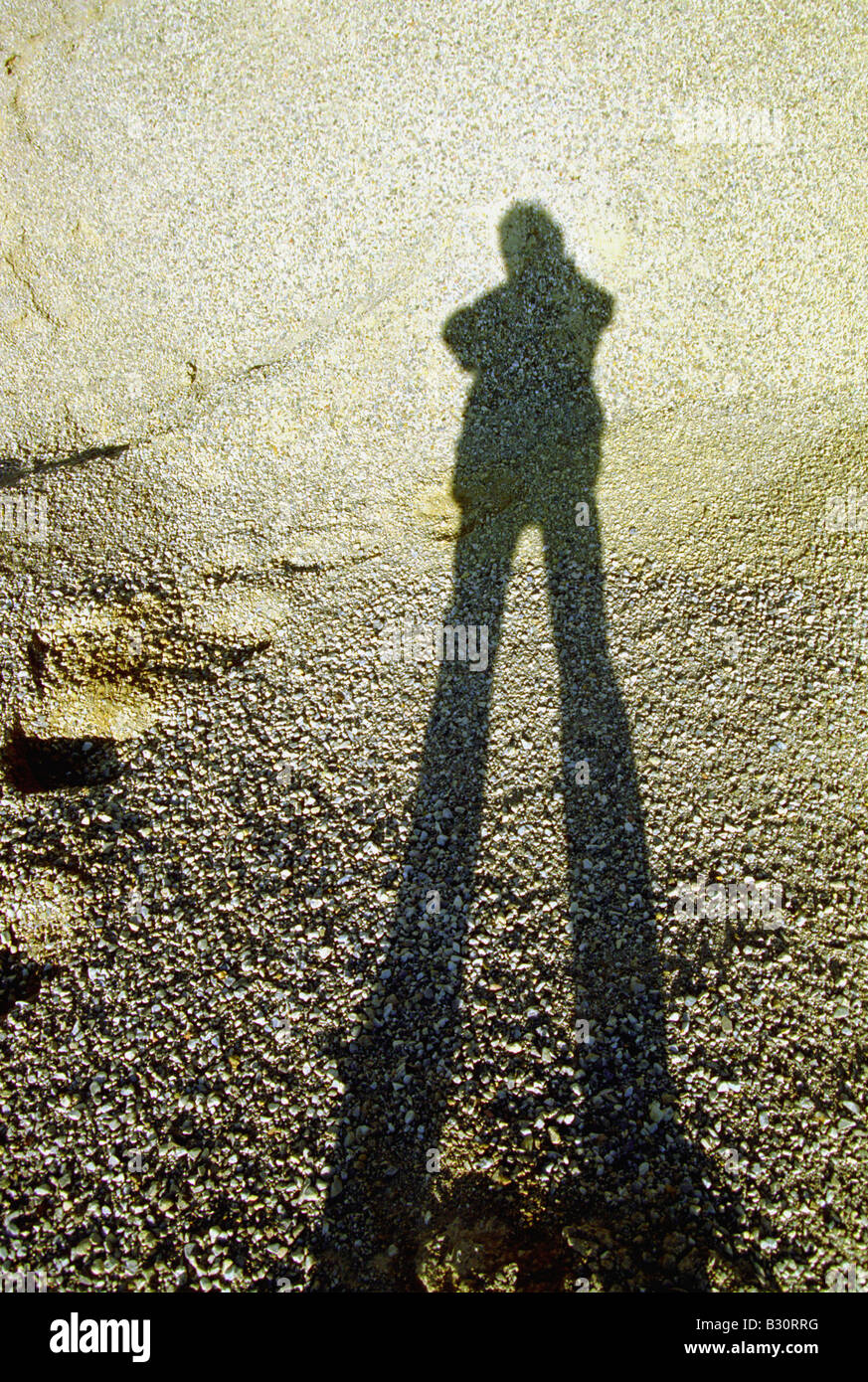 Shade figure in the heap of sand Stock Photo - Alamy