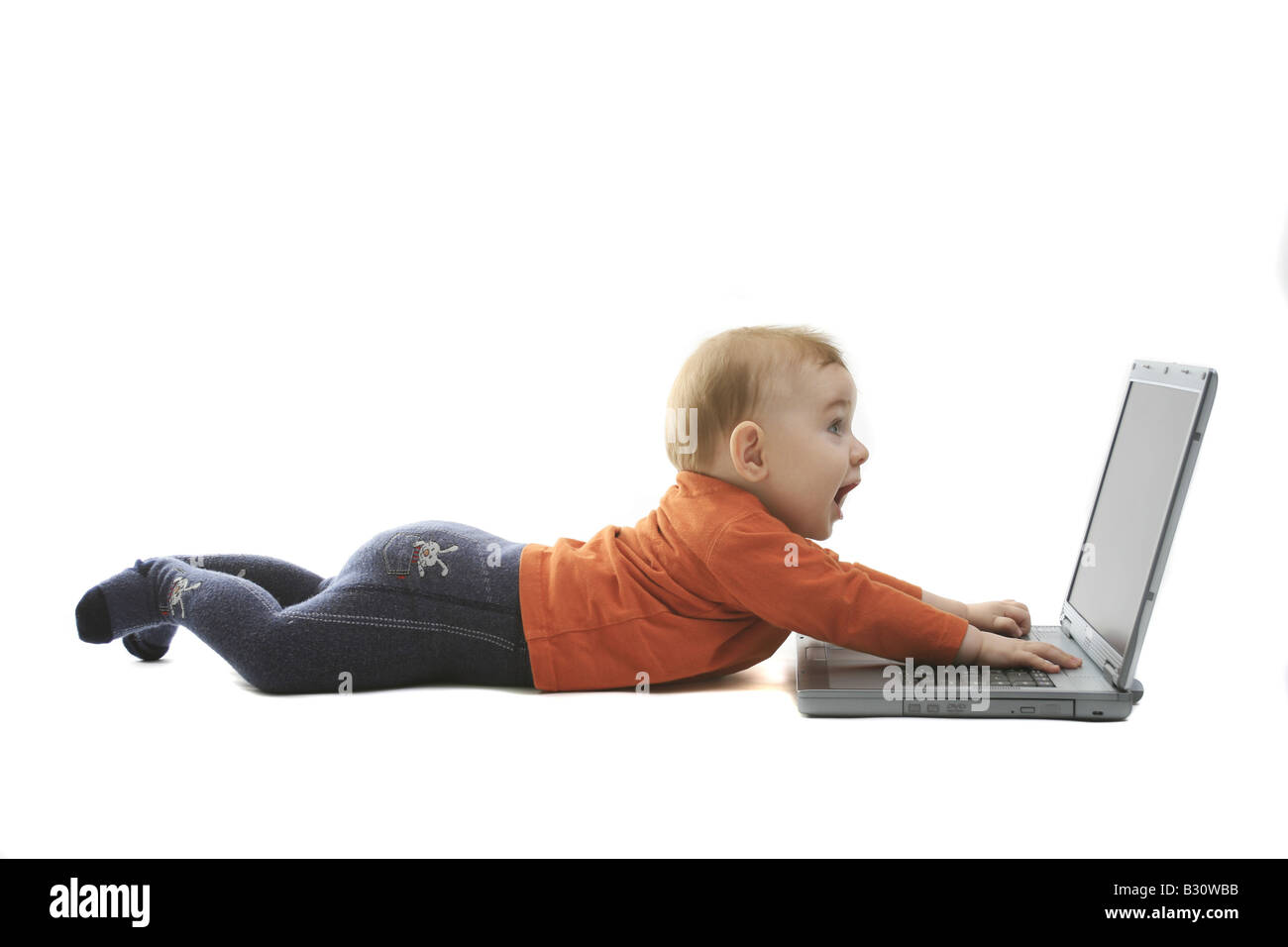baby playing with laptop Stock Photo - Alamy
