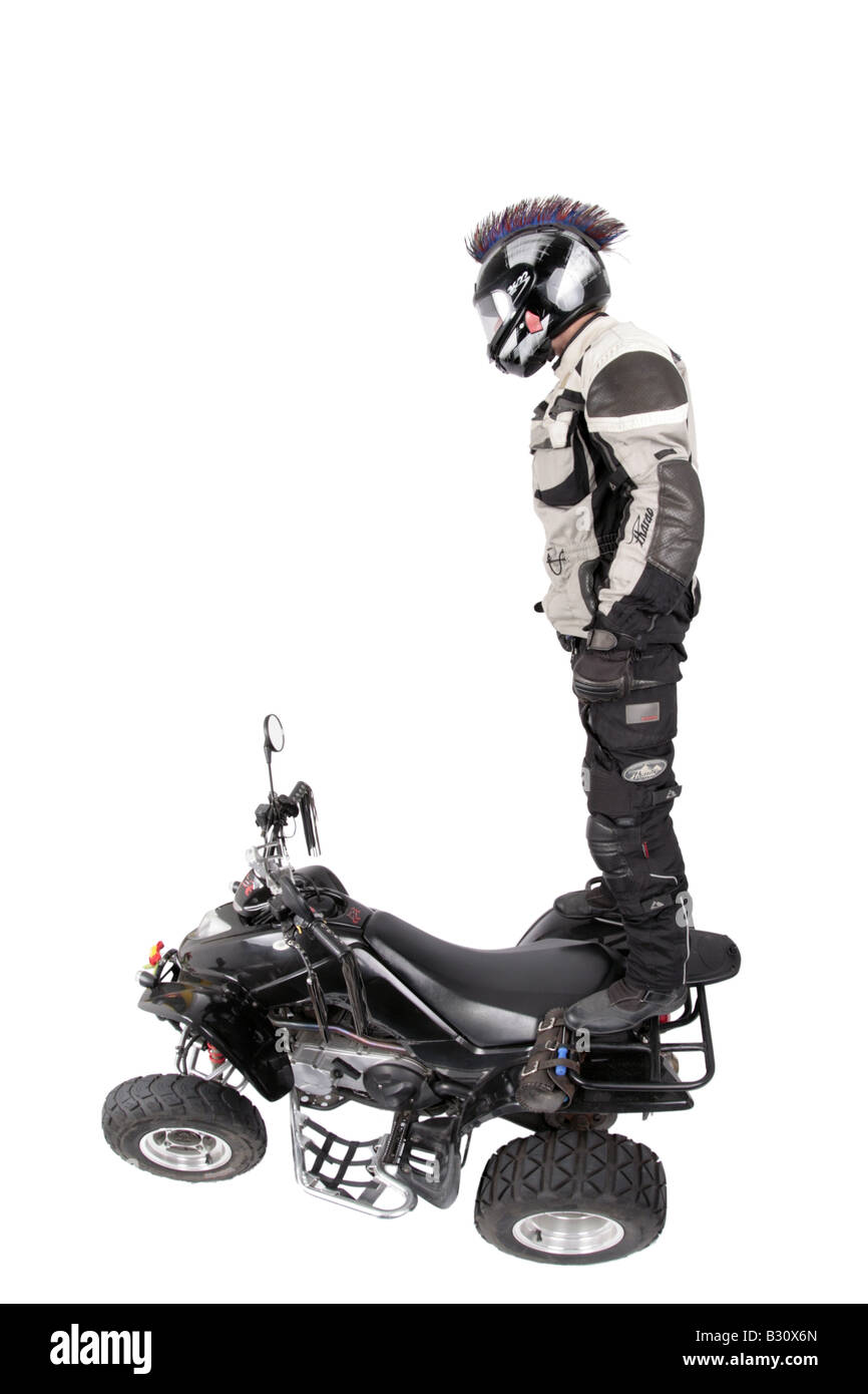 quod biker with helmet standing on his vehicle Stock Photo - Alamy