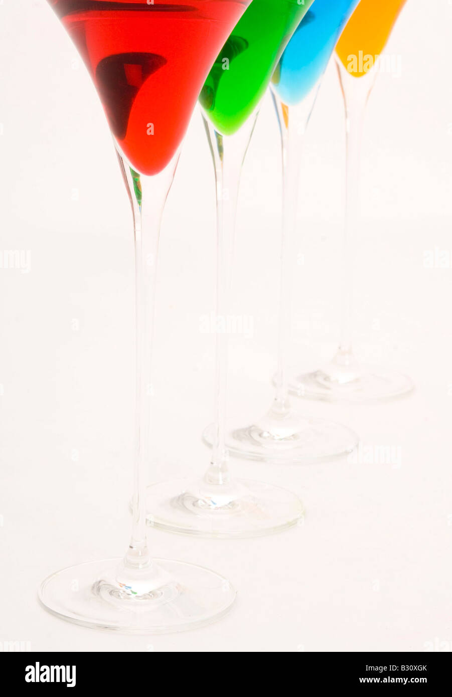 Four colorful cocktails on white background Stock Photo - Alamy