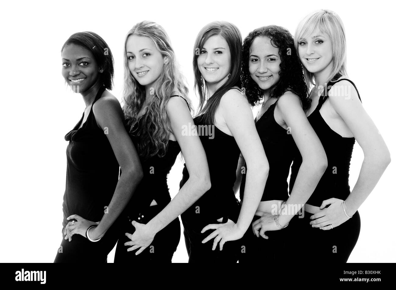 Five beautiful young women in black on white Stock Photo - Alamy