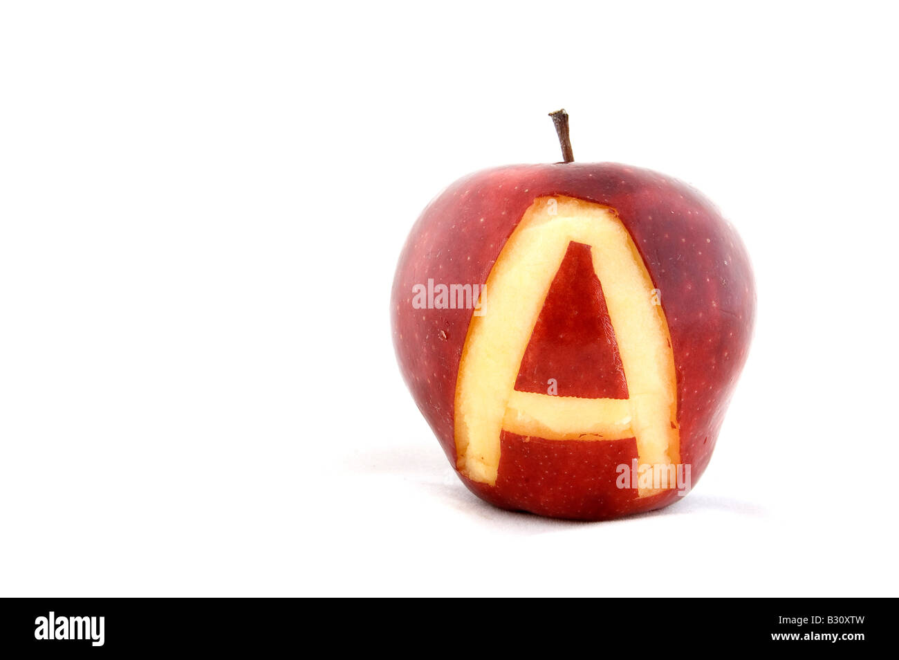 An apple with the letter A carved out of the skin Stock Photo - Alamy