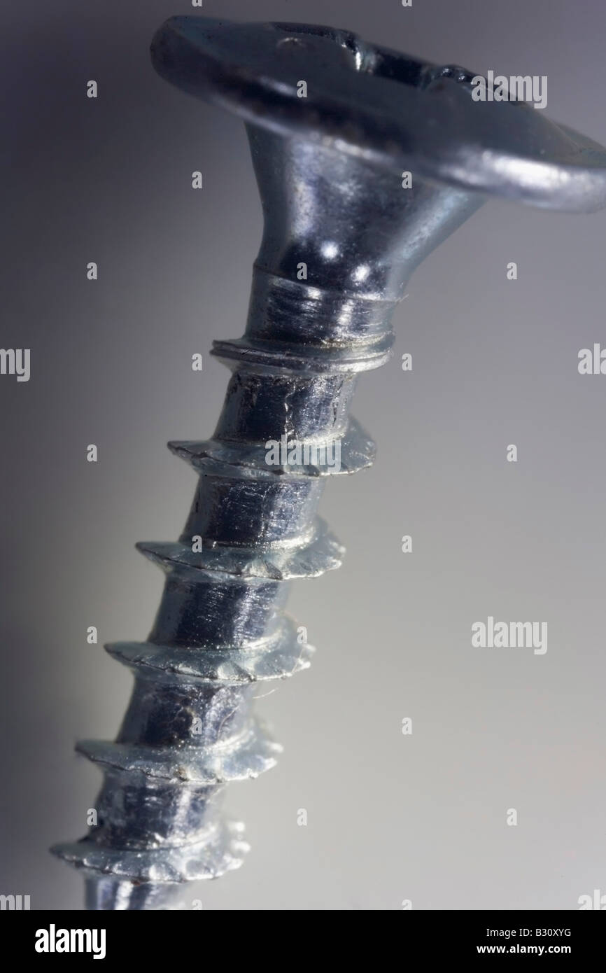 a close up image of a phillips screw Stock Photo - Alamy