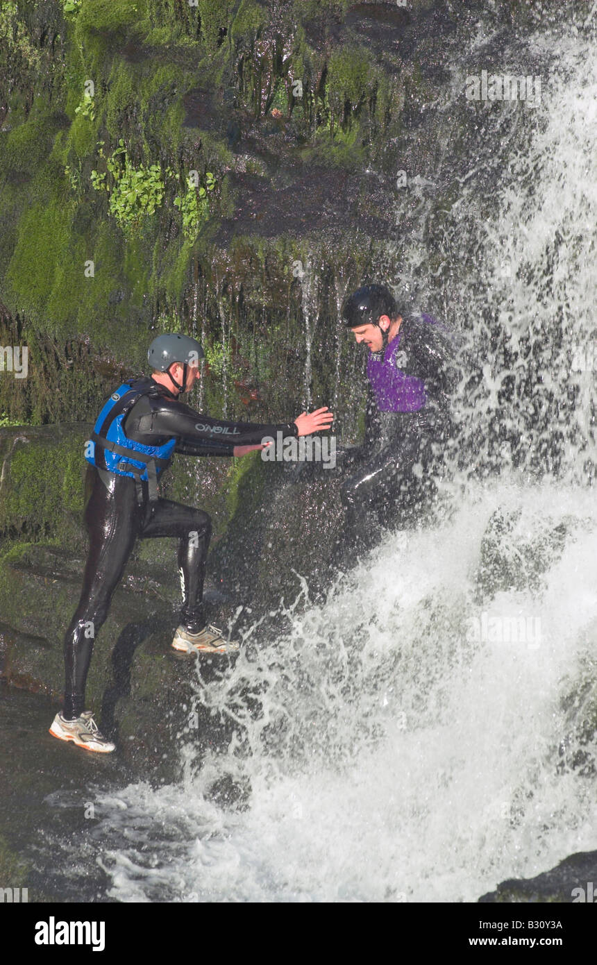 One man helping another man hi-res stock photography and images - Alamy