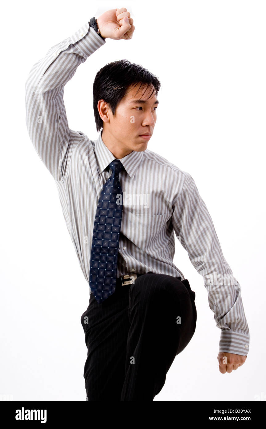 A young asian businessman in a tai chi pose Stock Photo - Alamy